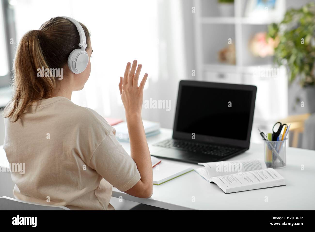student with laptop having video call at home Stock Photo - Alamy