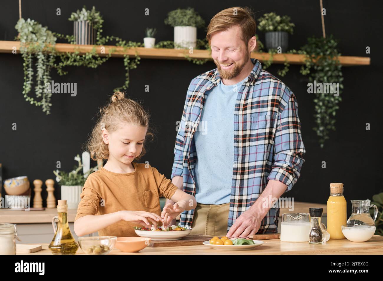 Boy helping his father hi-res stock photography and images - Alamy