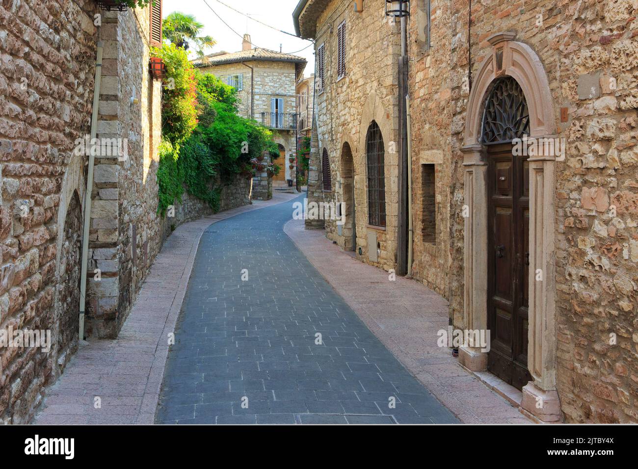 A cozy traditional back street in Assisi (province of Perugia) in ...