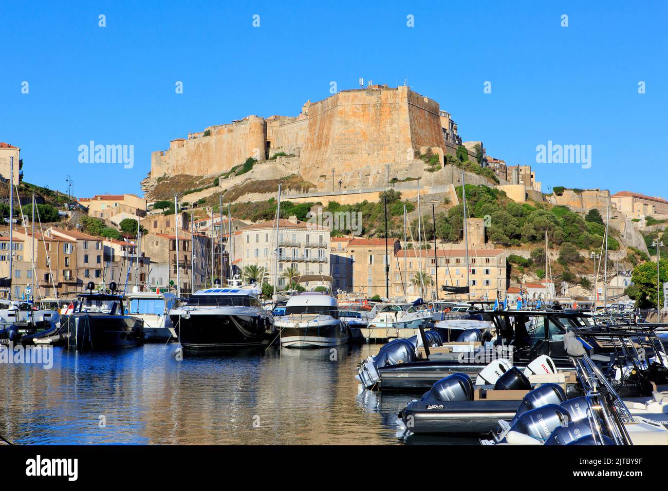 Panoramic view across the medieval citadel from the marina of Bonifacio ...