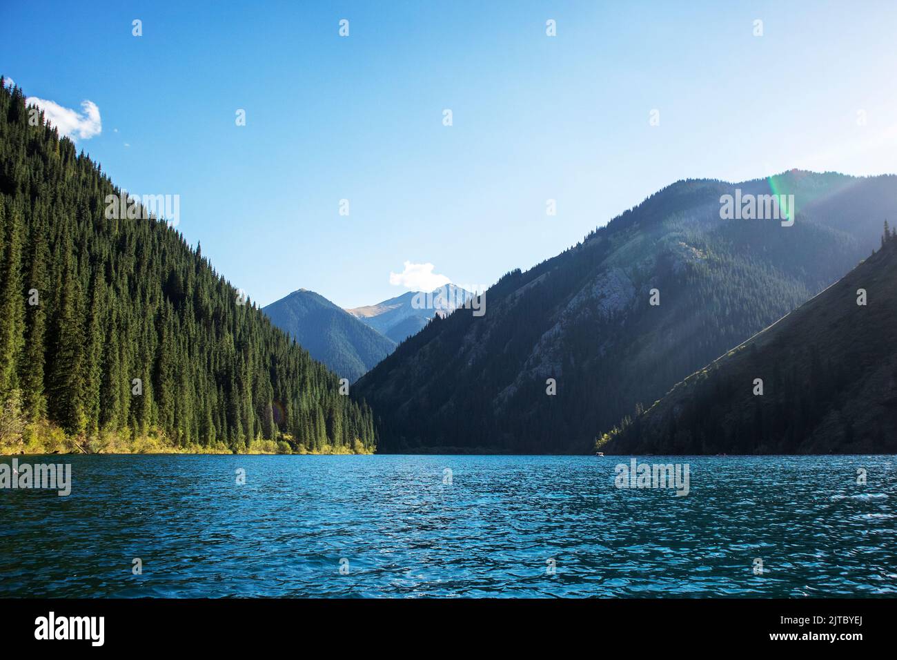 boats on a mountain lake. beautiful mountain lake and forest around ...