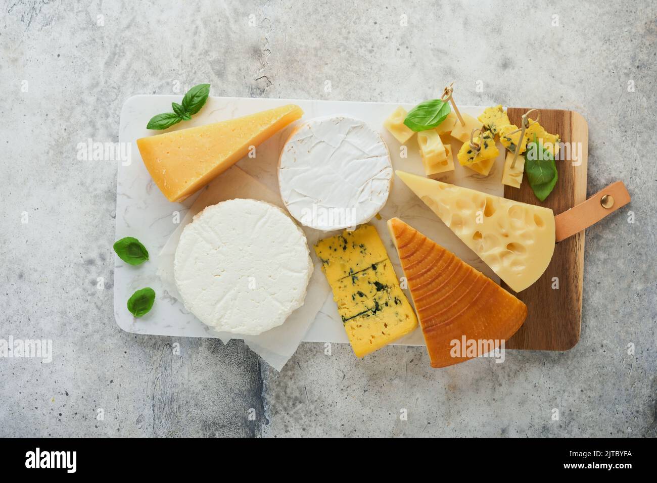 Set or assortment cheeses. Maasdam, smoked cheese, camembert, blue ...