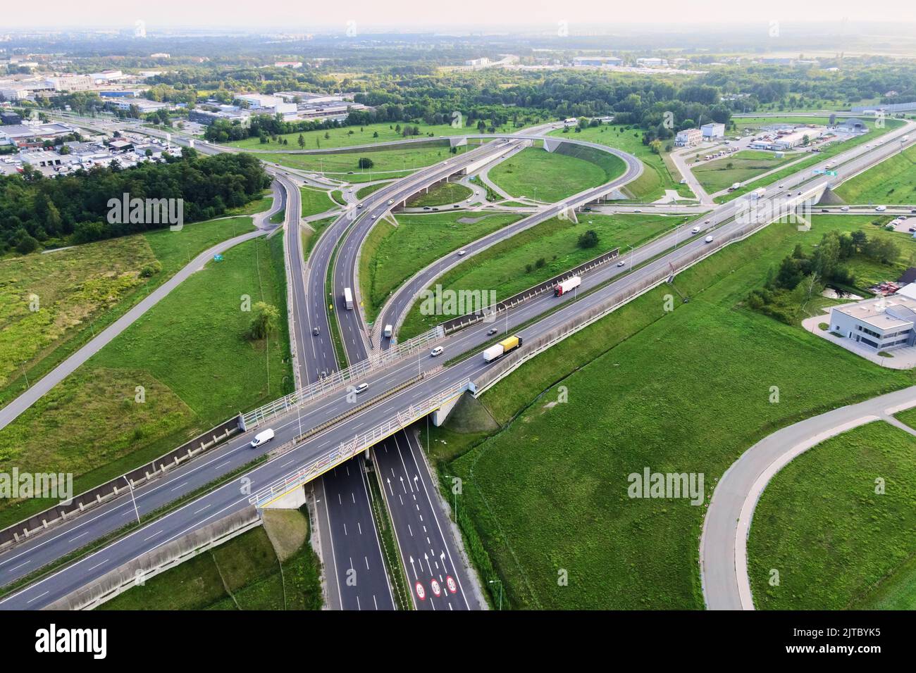 Aerial view of cars driving on round intersection in city ...