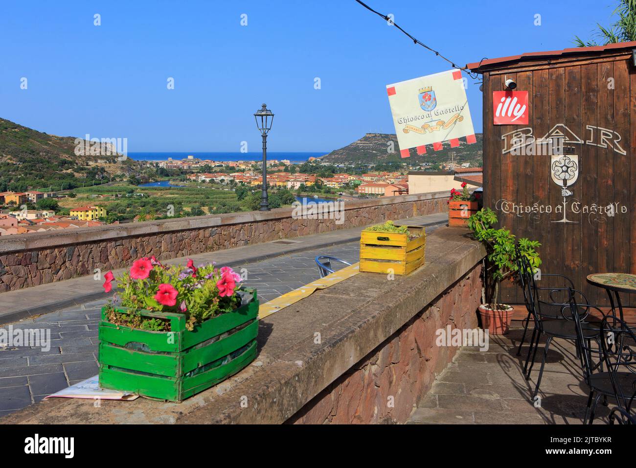 A panoramic view from a cozy bar across the colorful town of Bosa at ...