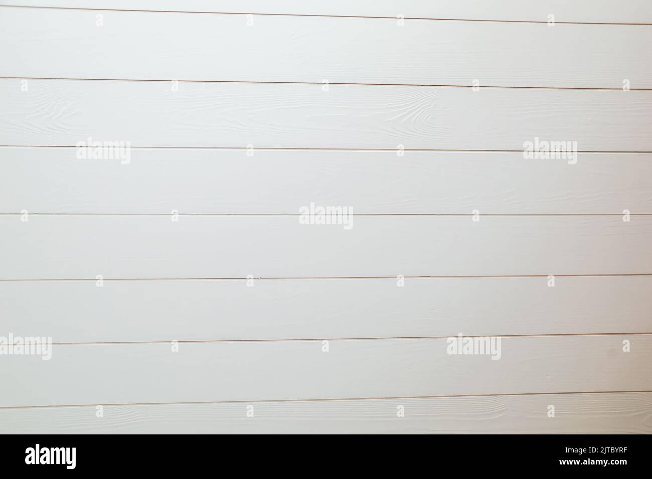 White shiplap plank wall in a hallway, bedroom, living room, den ...