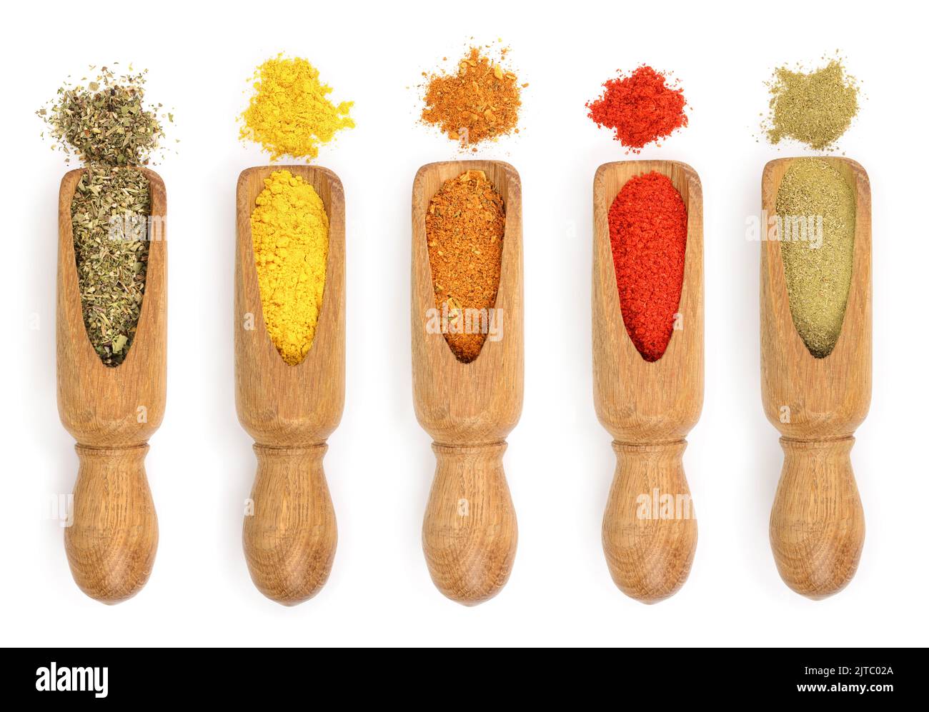 mix of spices in wooden scoop isolated on a white background. Top view. Flat lay. Set or ...