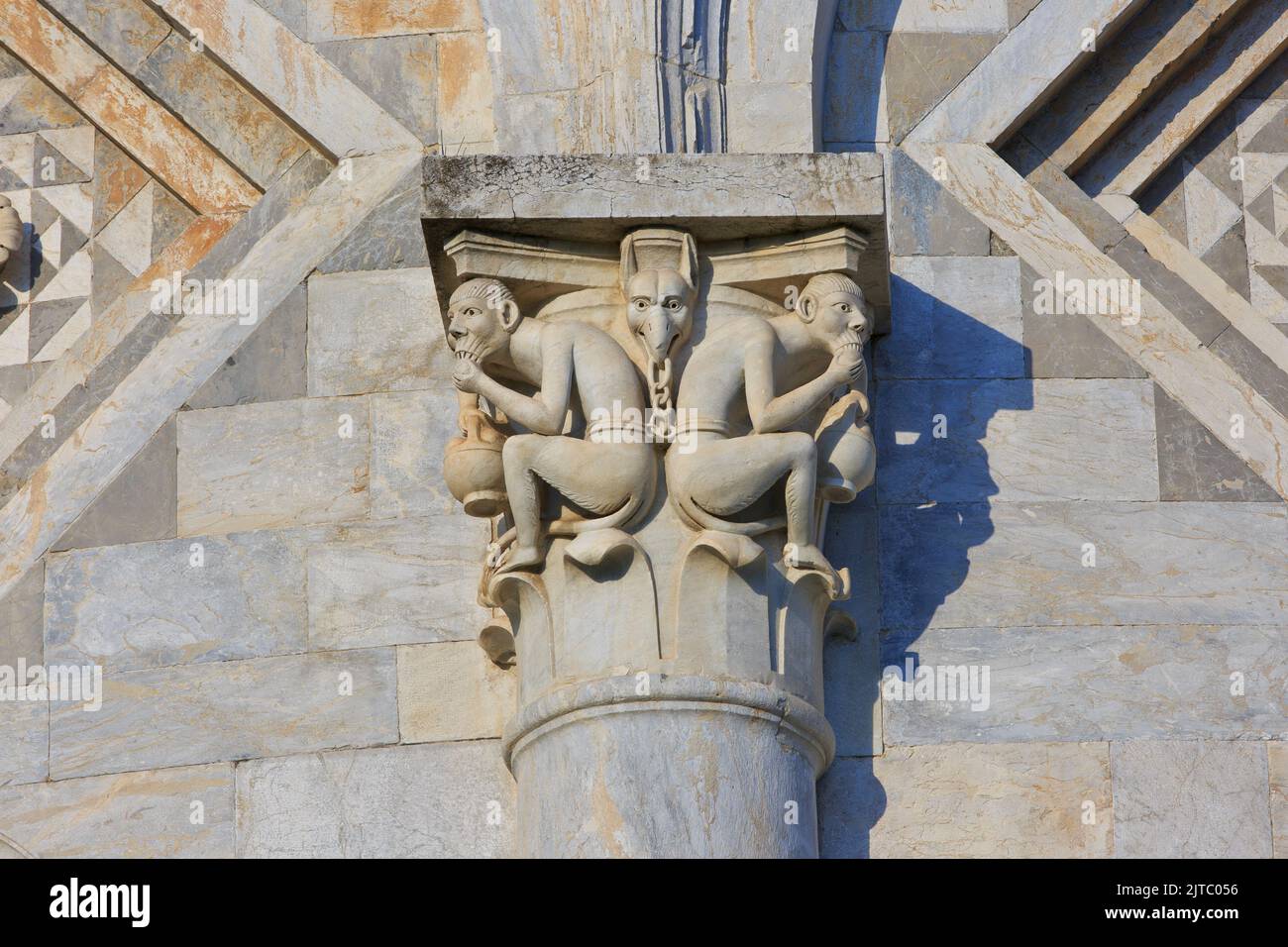 Statues of monkeys decorating a column of the leaning tower of Pisa (a ...