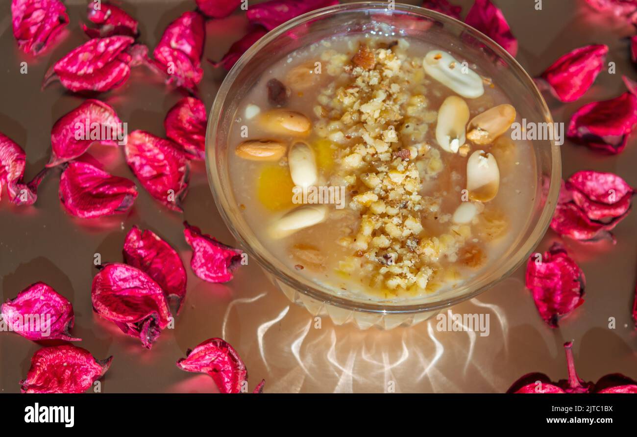 Ashura is a dessert made from a mixture of cereals, fruits, dried ...