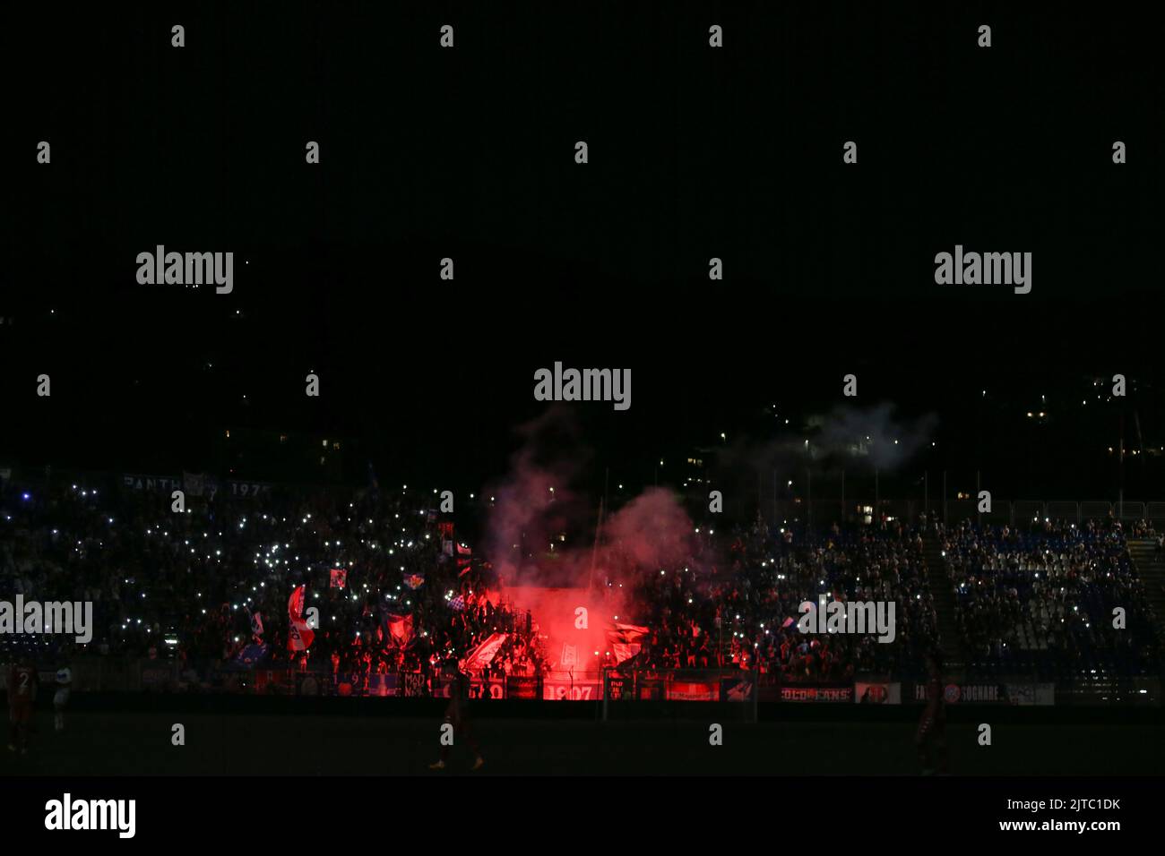 Como, Italy, 29th August 2022. Como fans light flares during a ... Como, Italy, 29th August 2022. Como fans light flares during a ...