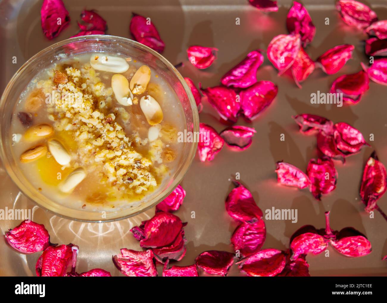 Ashura is a dessert made from a mixture of cereals, fruits, dried ...