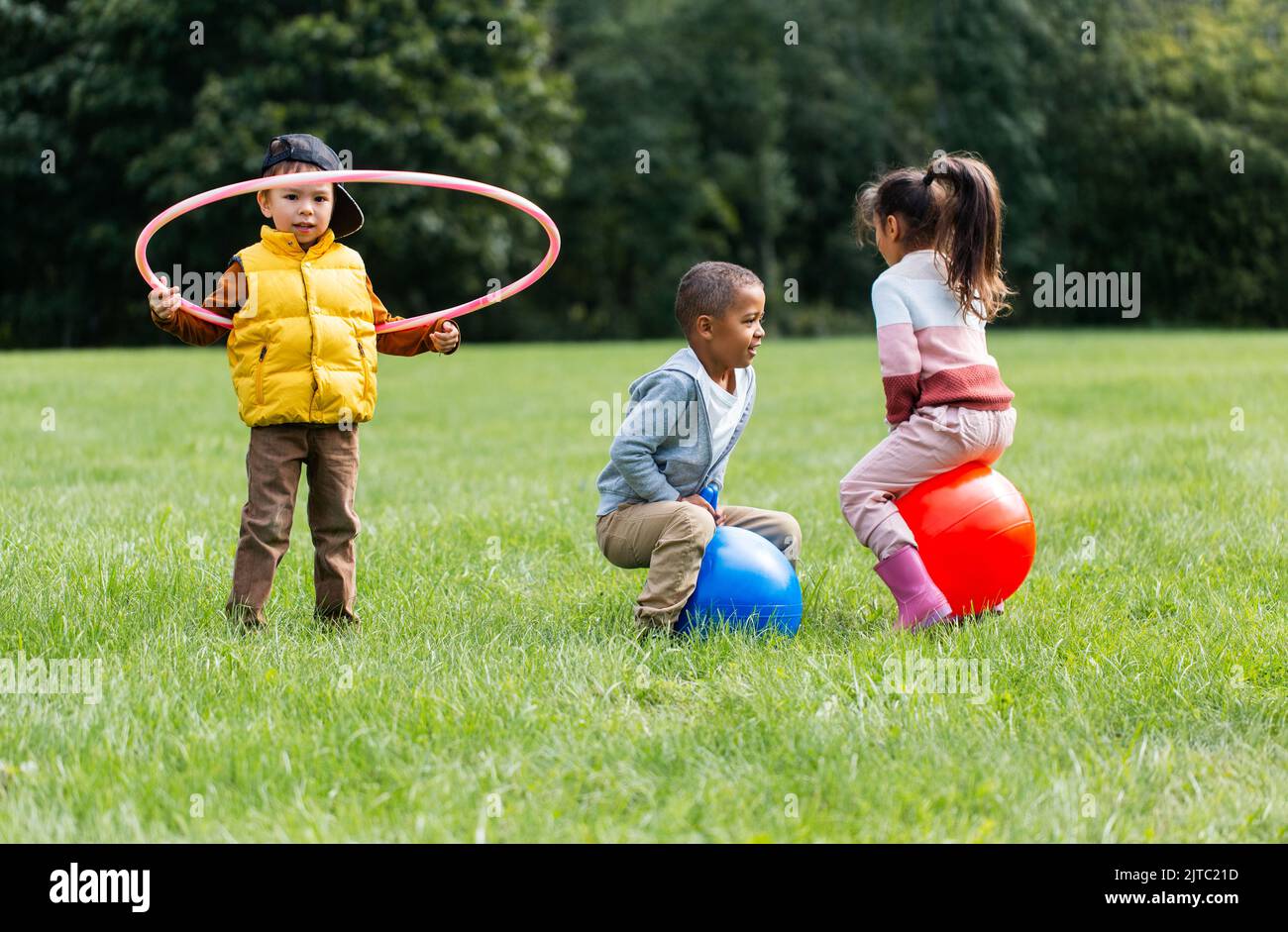 Happy kid hula hoop african american hi-res stock photography and ...