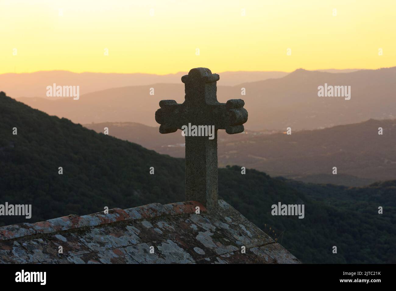 A Christian stone cross atop of a mausoleum at the cemetery of Sartene ...