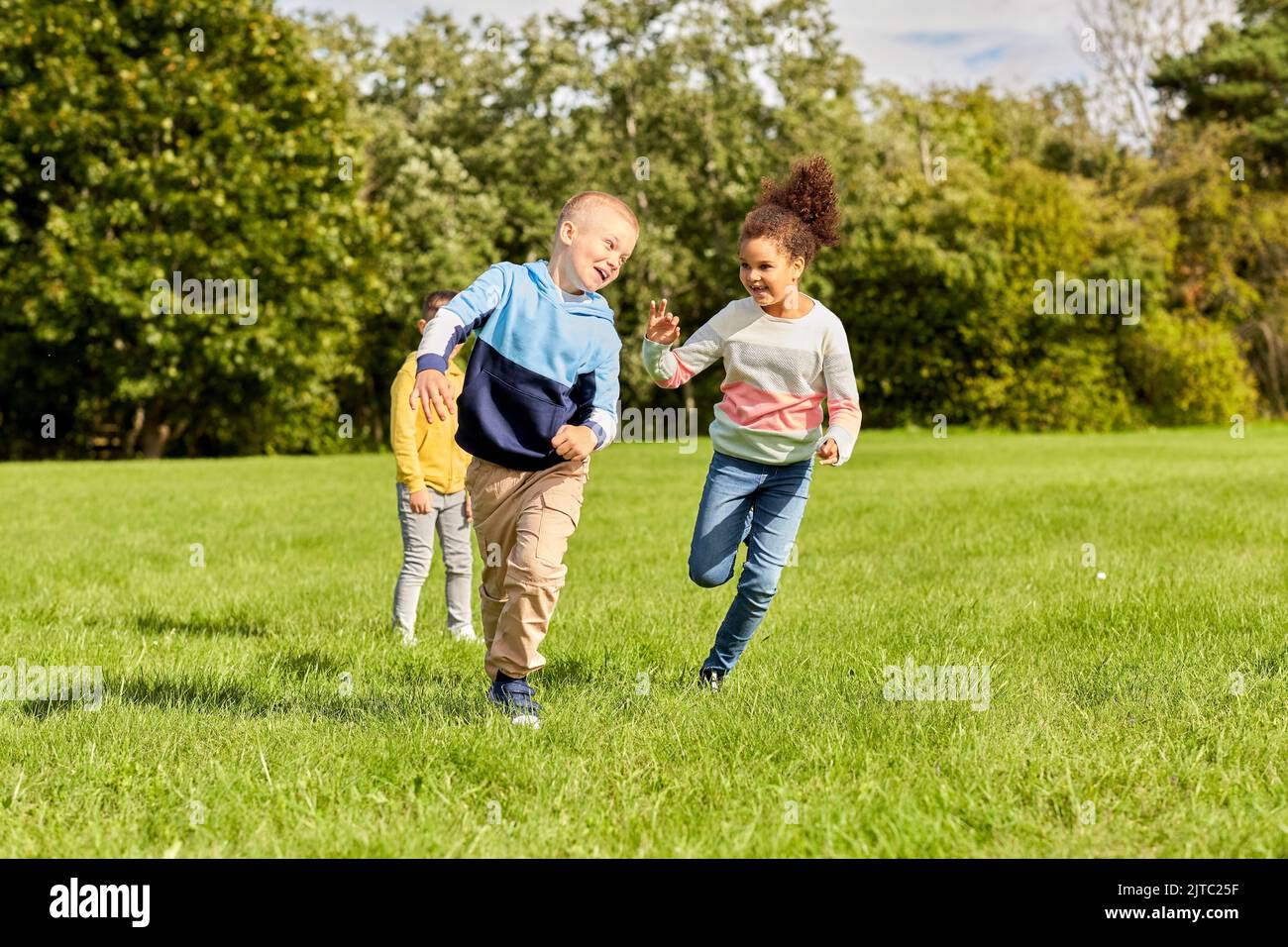 Children running field multiethnic hi-res stock photography and images ...