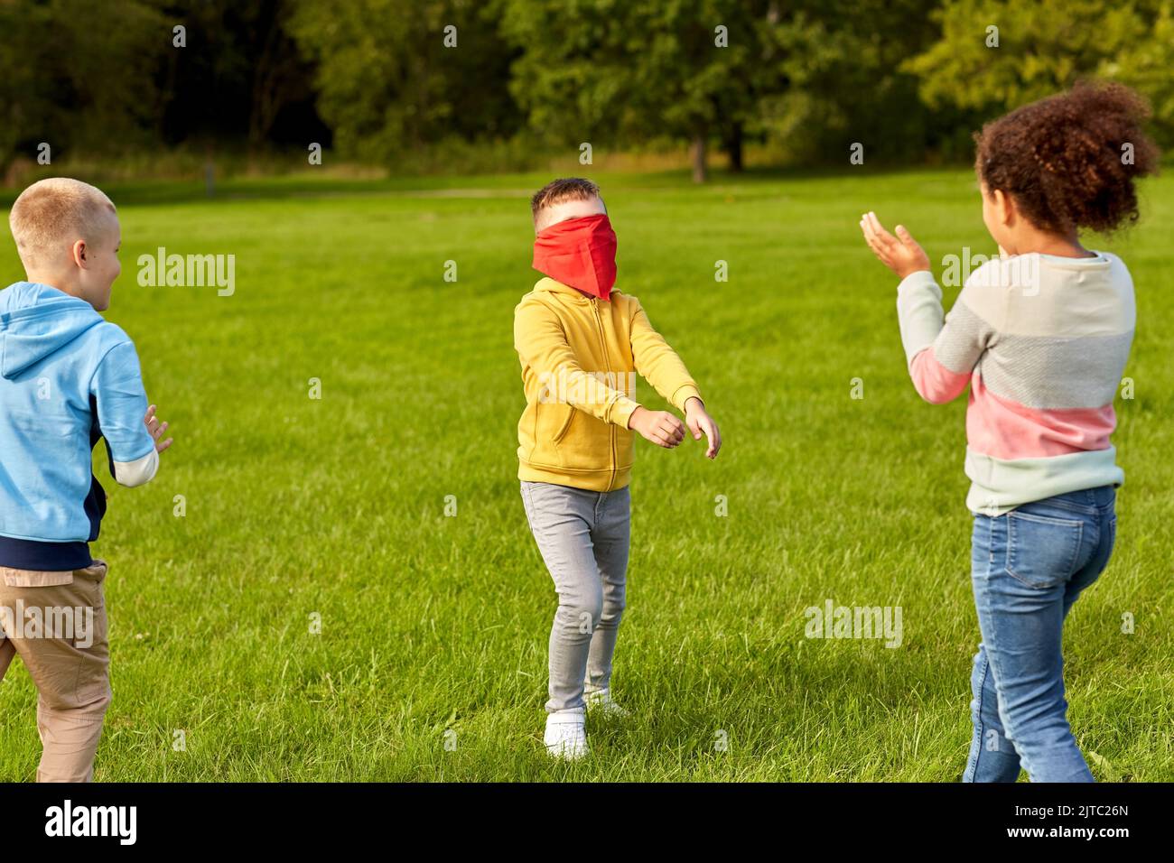 happy children playing and running at park Stock Photo - Alamy