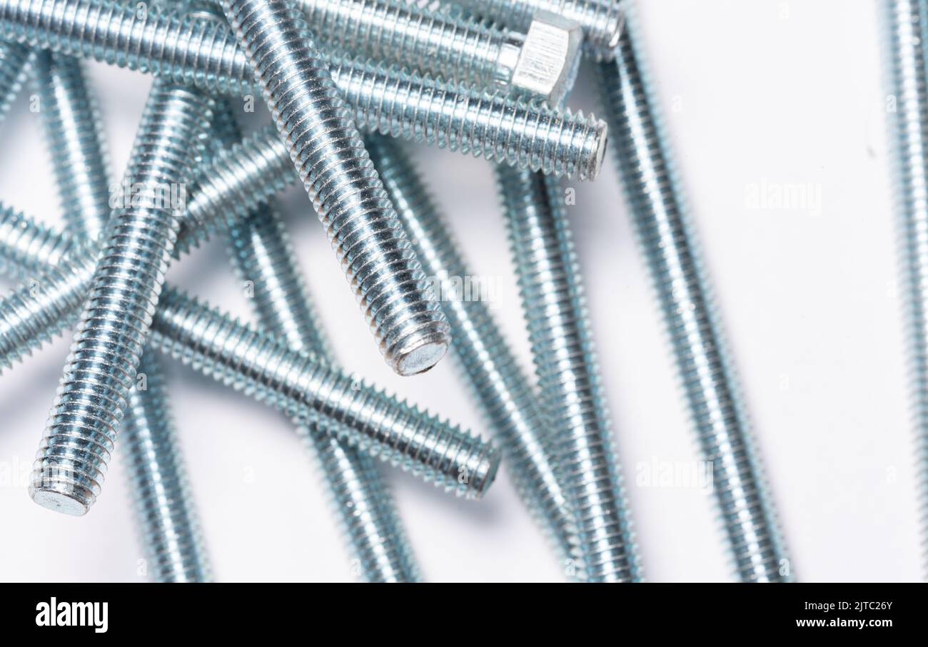Screws in close-up. Metal long threaded bolts. Metal items. Metal ...