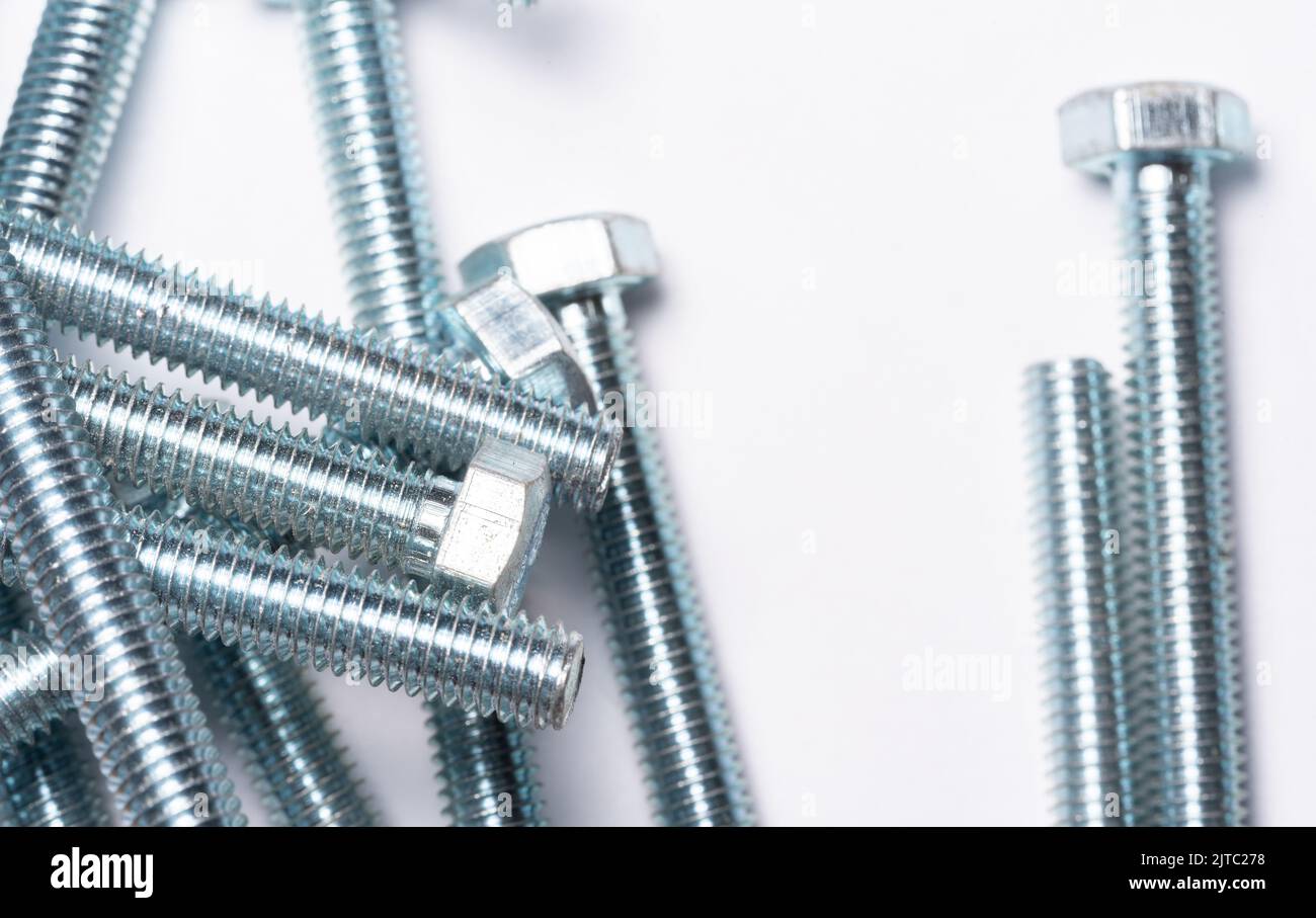 Screws in close-up. Metal long threaded bolts. Metal items. Metal ...