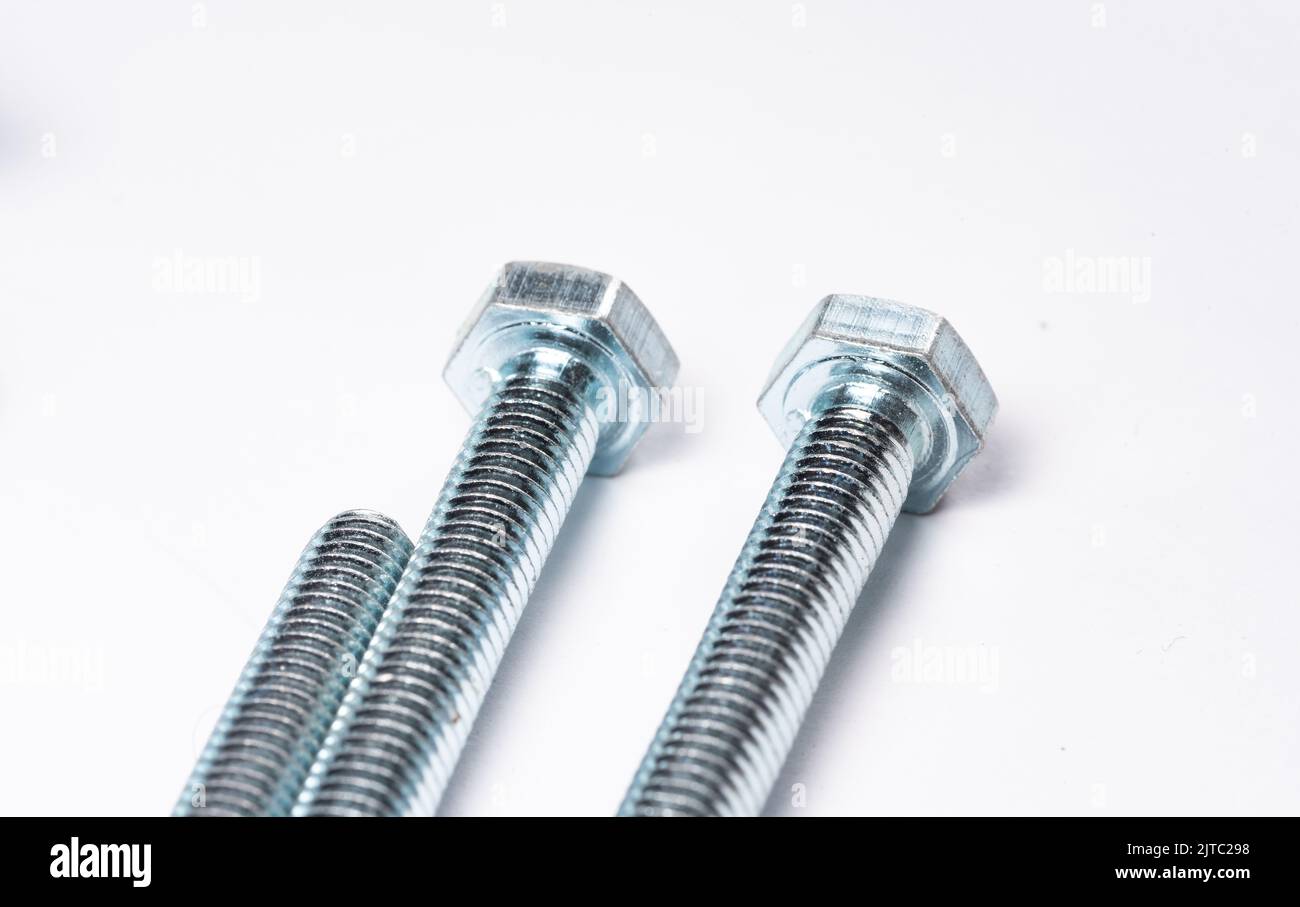 Screws in close-up. Metal long threaded bolts. Metal items. Metal ...
