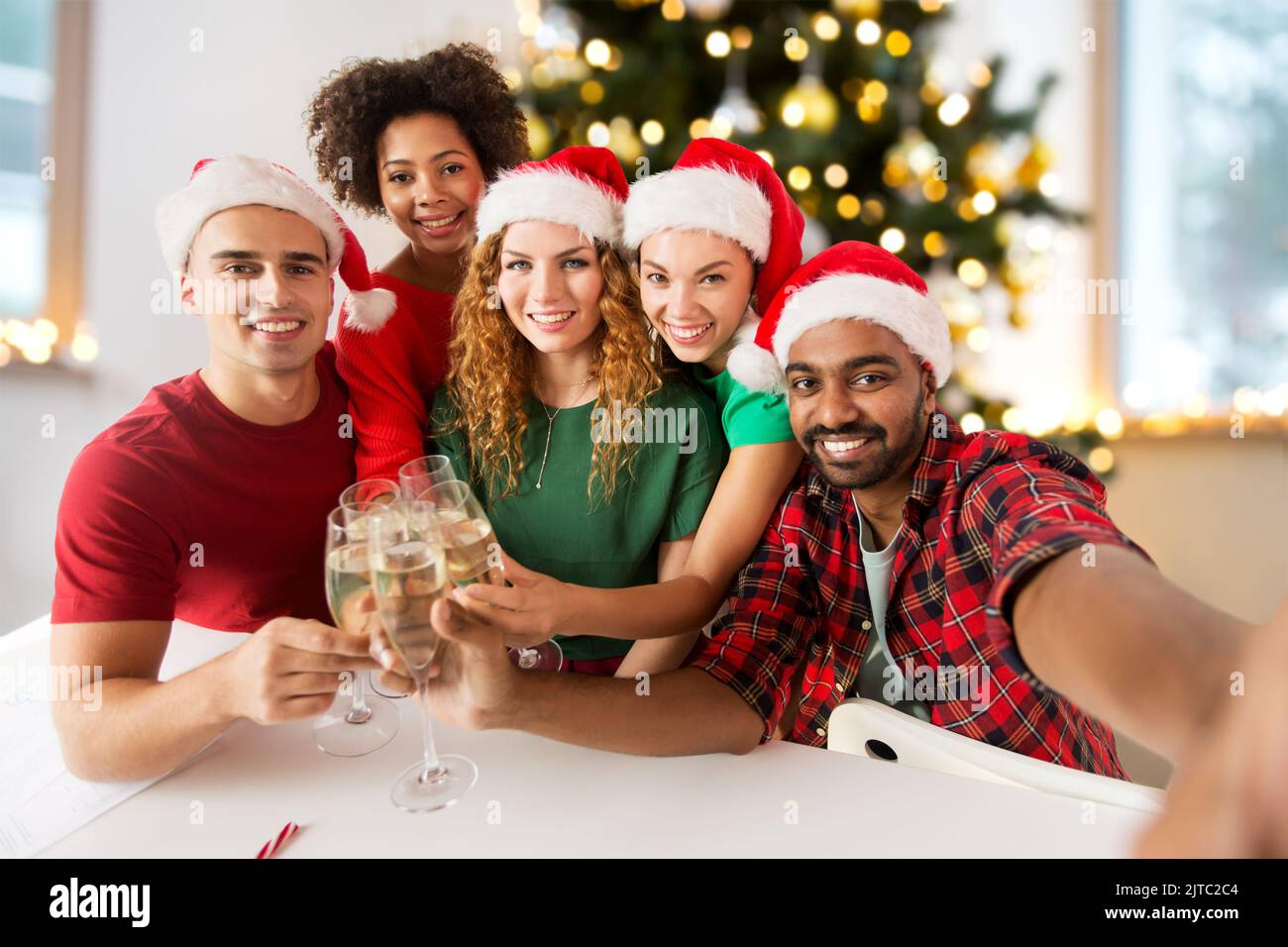 happy team celebrating christmas at office party Stock Photo - Alamy