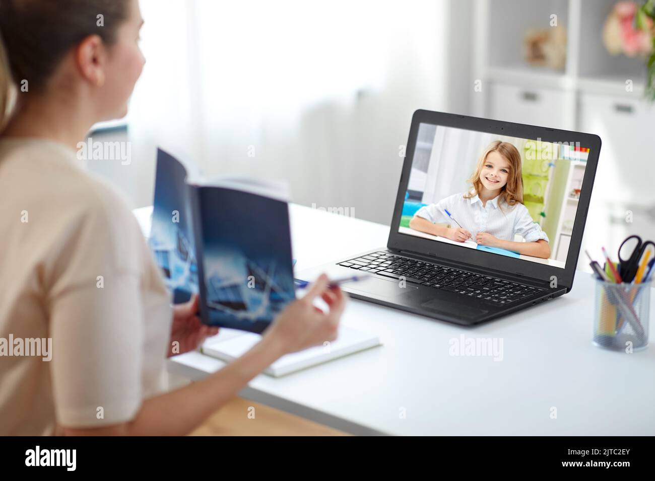 math teacher having online class with student girl Stock Photo - Alamy