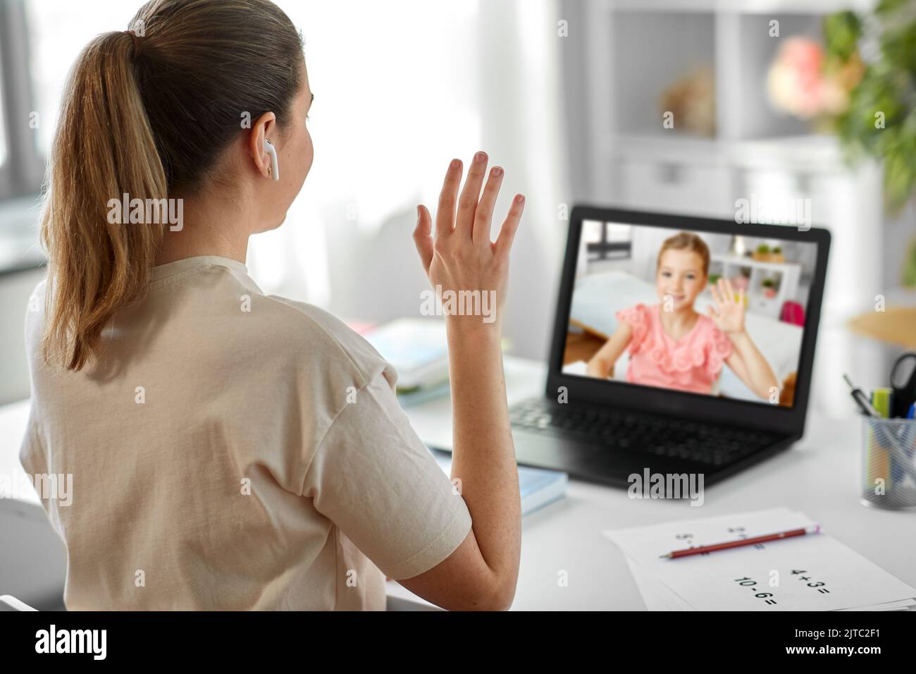 math teacher having online class with student girl Stock Photo - Alamy