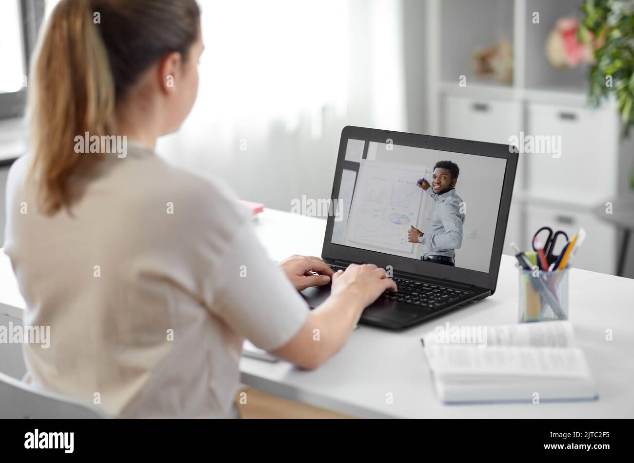 student woman with laptop having online class Stock Photo - Alamy