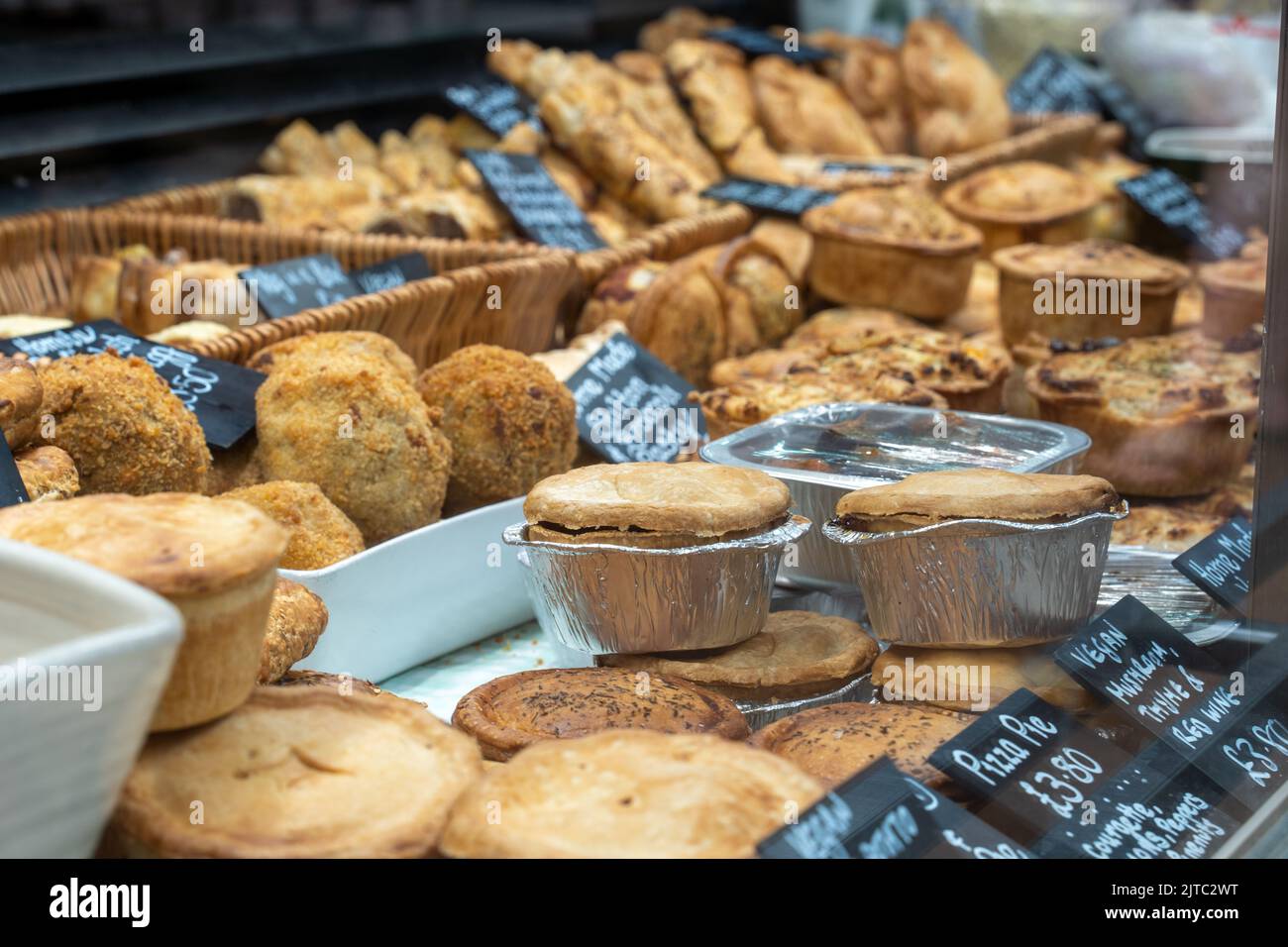 Pies, pasties and other pastries displayed at a farm shop in England ...