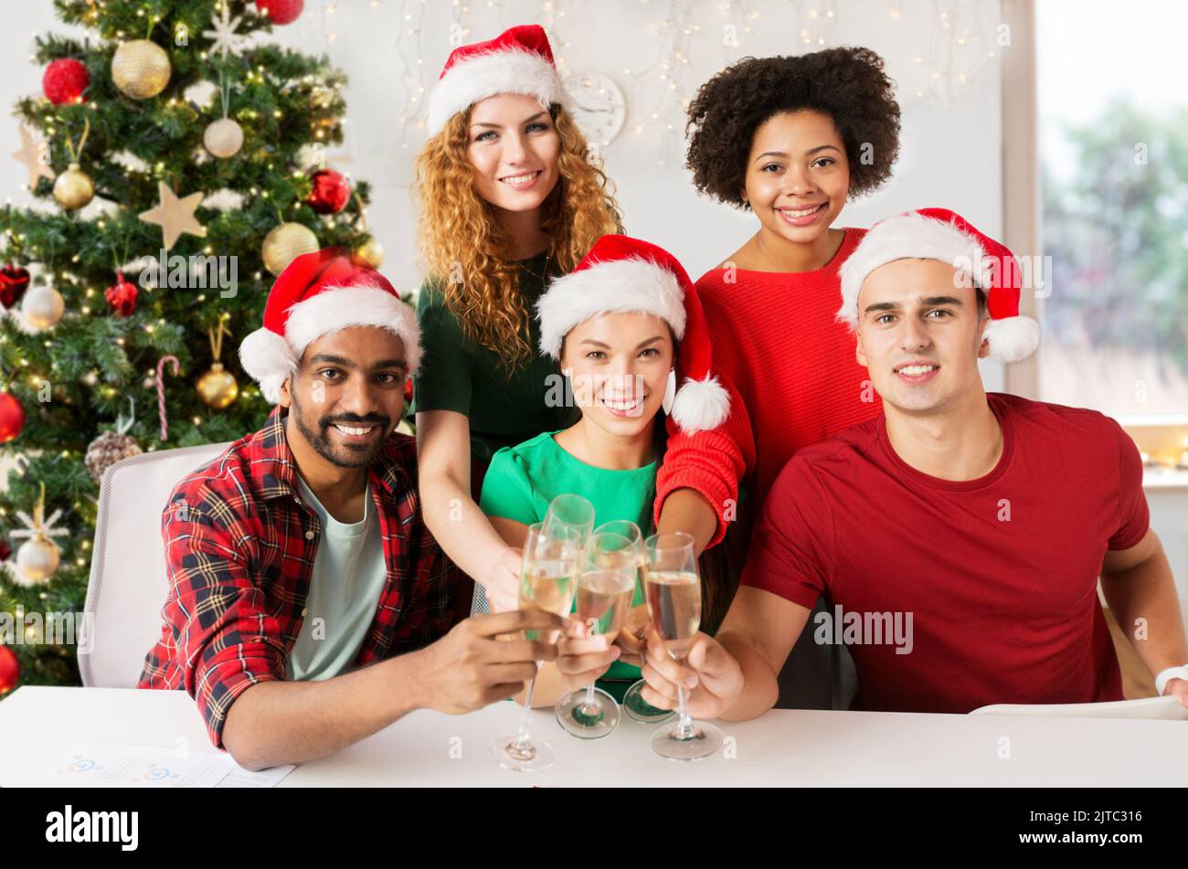 happy team celebrating christmas at office party Stock Photo - Alamy