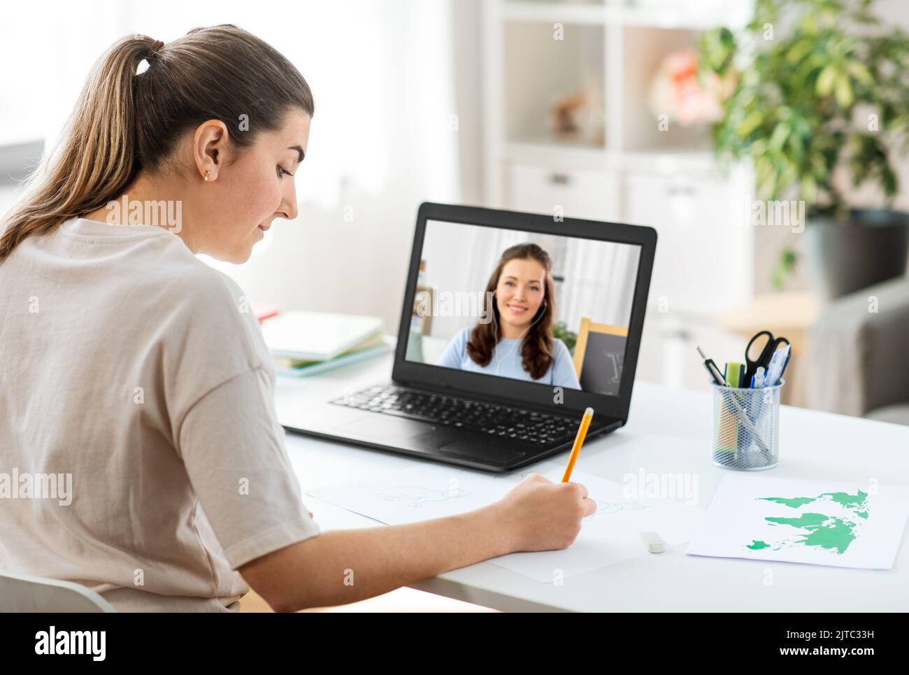 woman having video call on laptop and drawing Stock Photo - Alamy