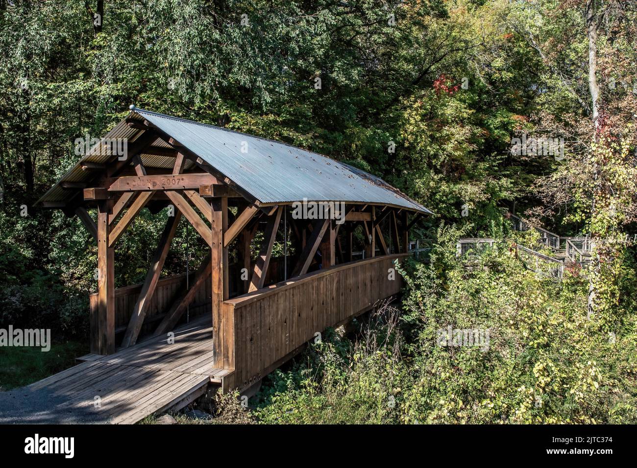 Covered bridge in the fall built in July 2007 by volunteers along the St. Croix River in Taylors ...