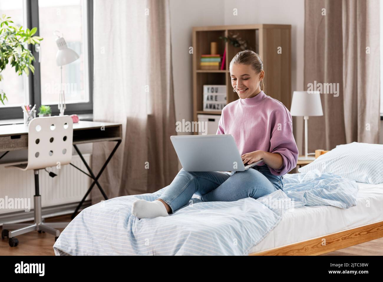 student girl with laptop computer learning at home Stock Photo - Alamy