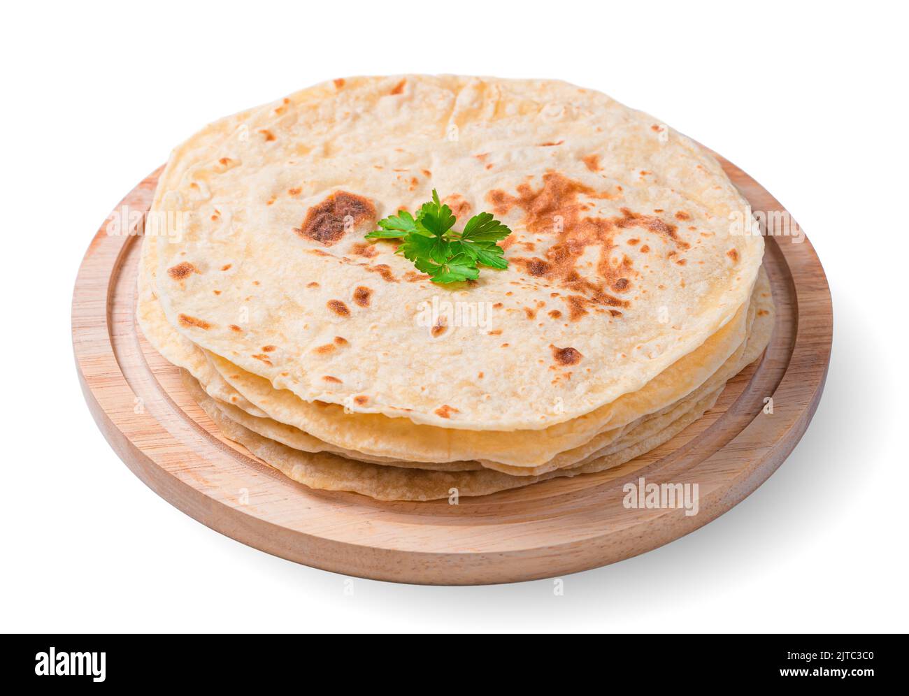 Indian, traditional chapati tortillas with fresh herbs are close-up ...