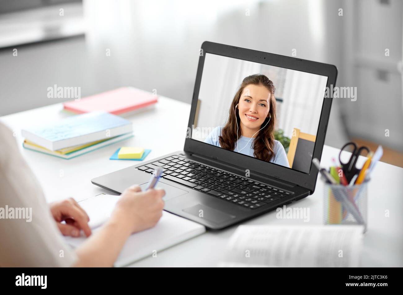 student with laptop having video call with teacher Stock Photo - Alamy
