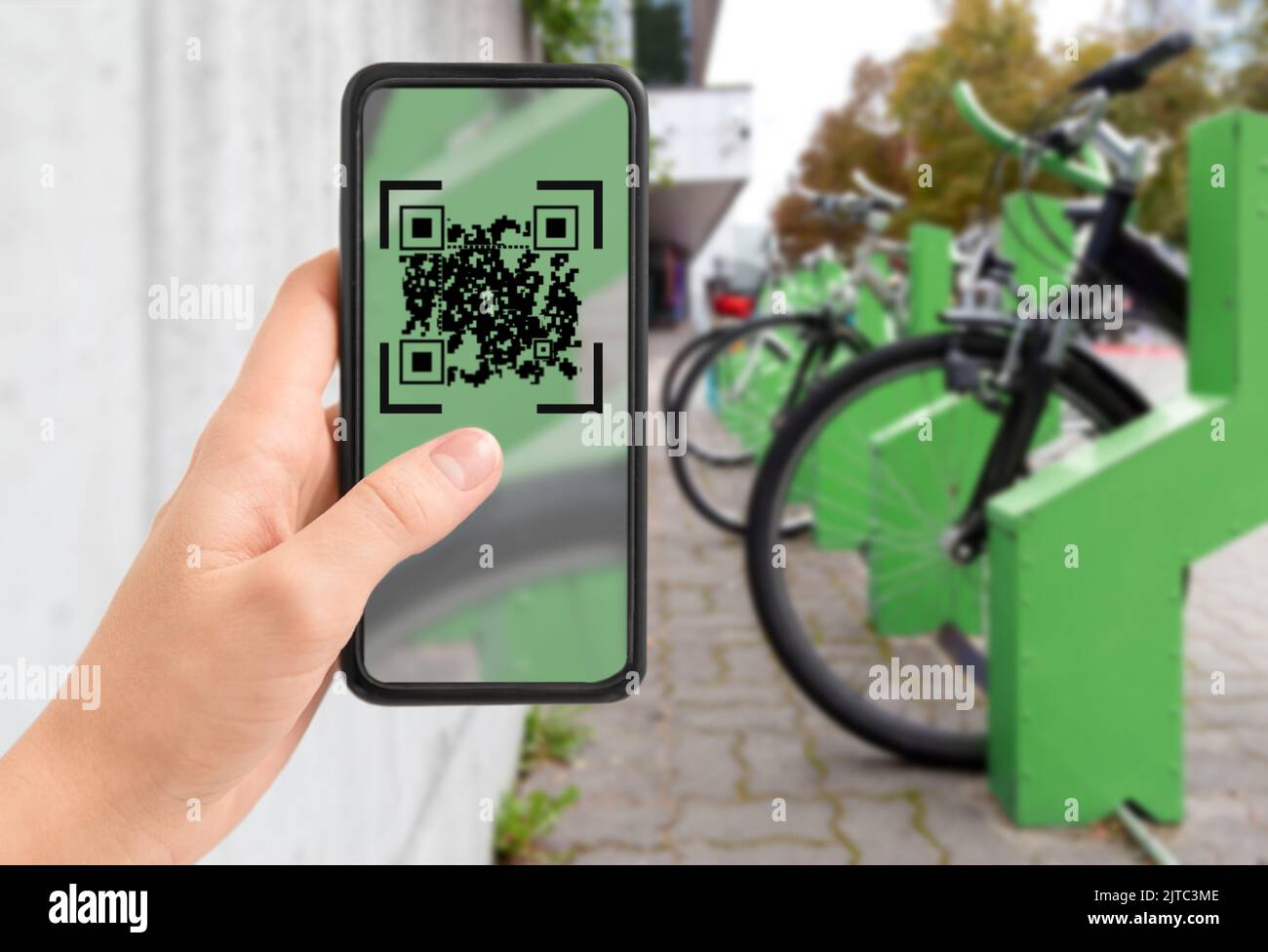 qr code on phone at electric bike charging station Stock Photo - Alamy