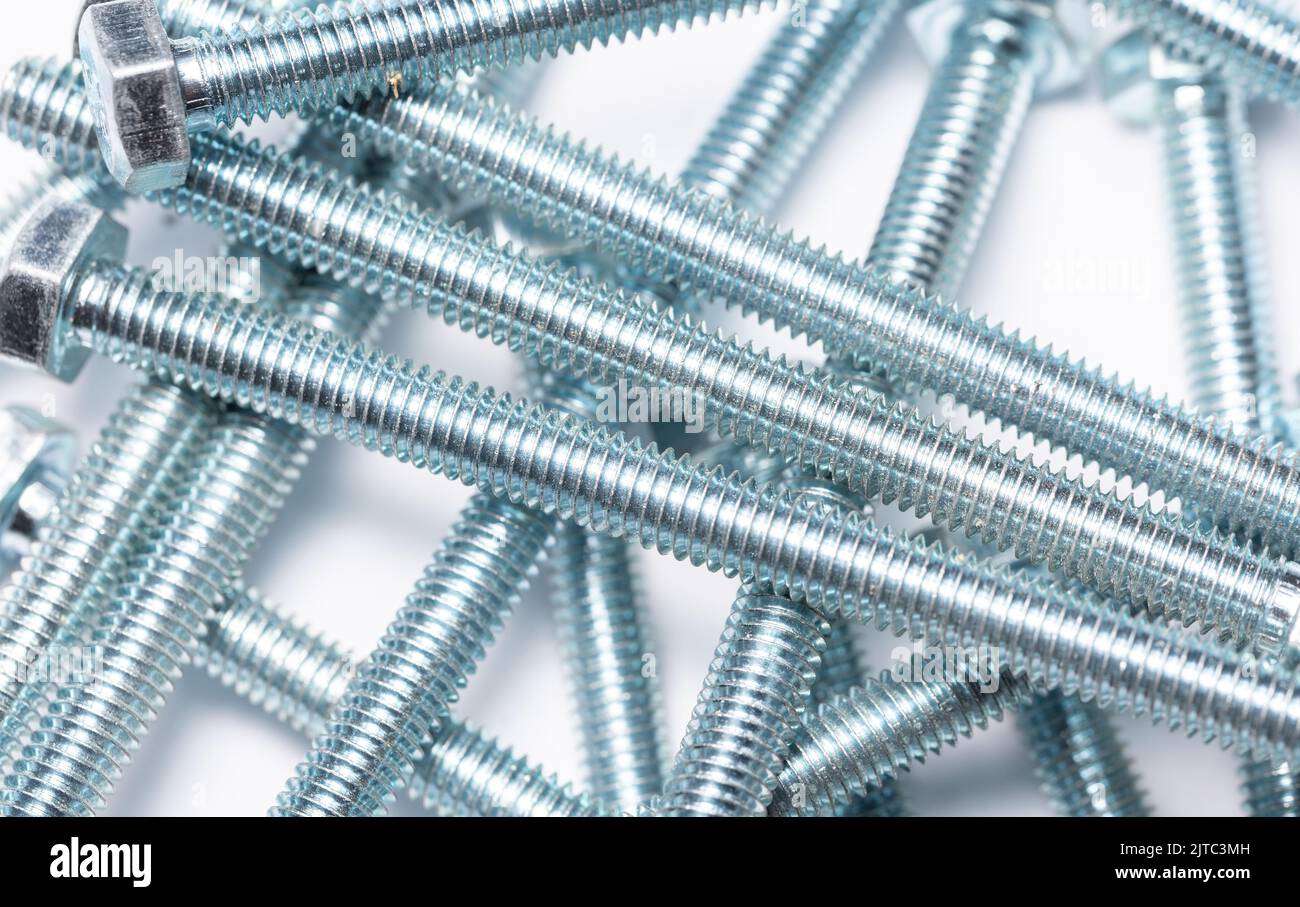 Screws in close-up. Metal long threaded bolts. Metal items. Metal ...
