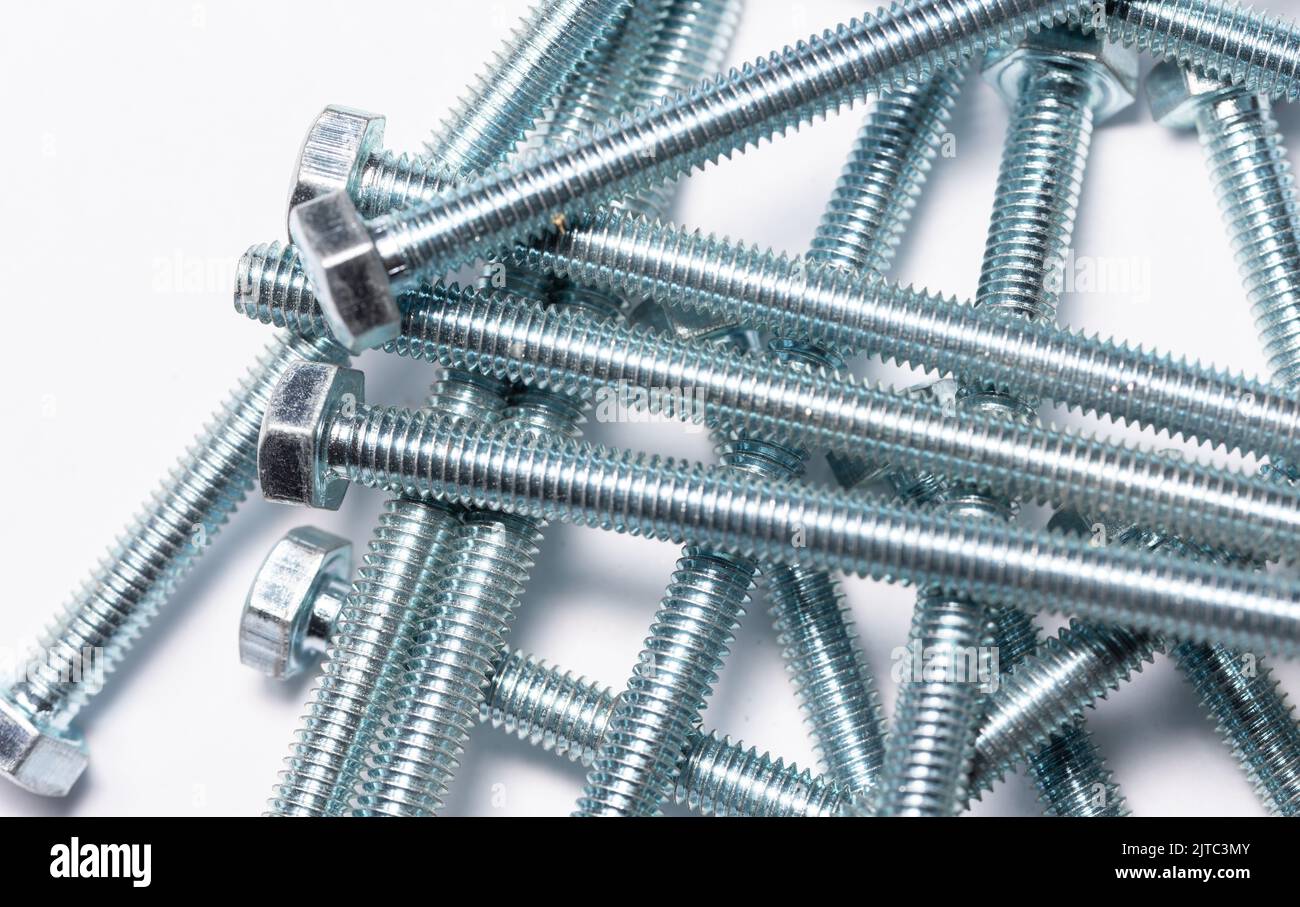 Screws in close-up. Metal long threaded bolts. Metal items. Metal ...