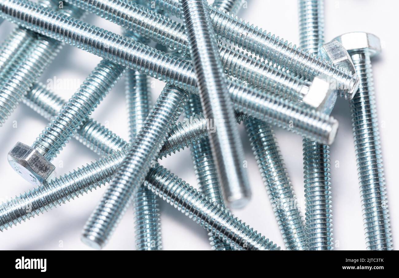 Screws in close-up. Metal long threaded bolts. Metal items. Metal ...