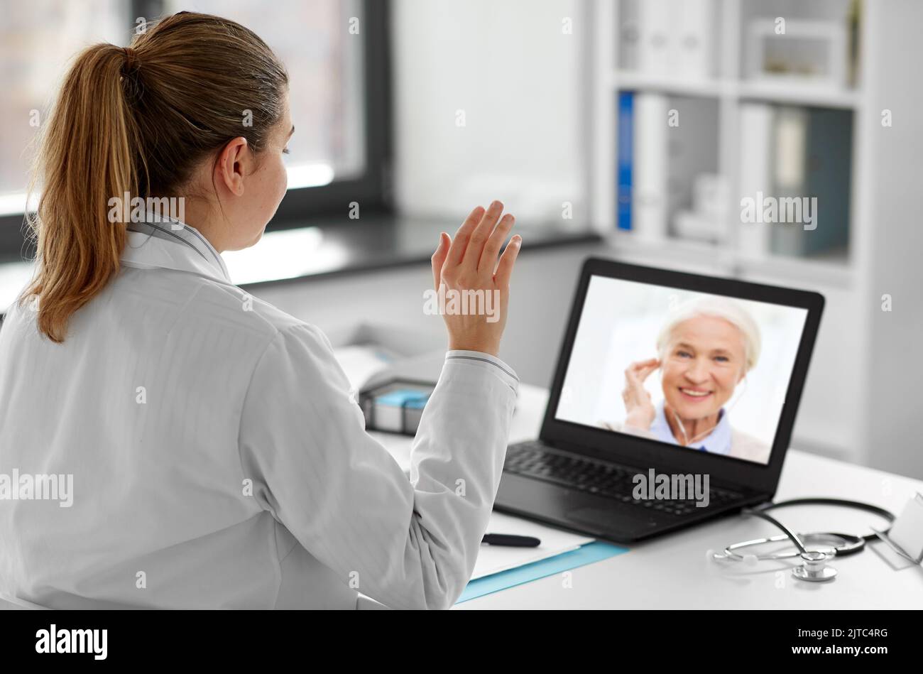 doctor with laptop having video call with patient Stock Photo - Alamy