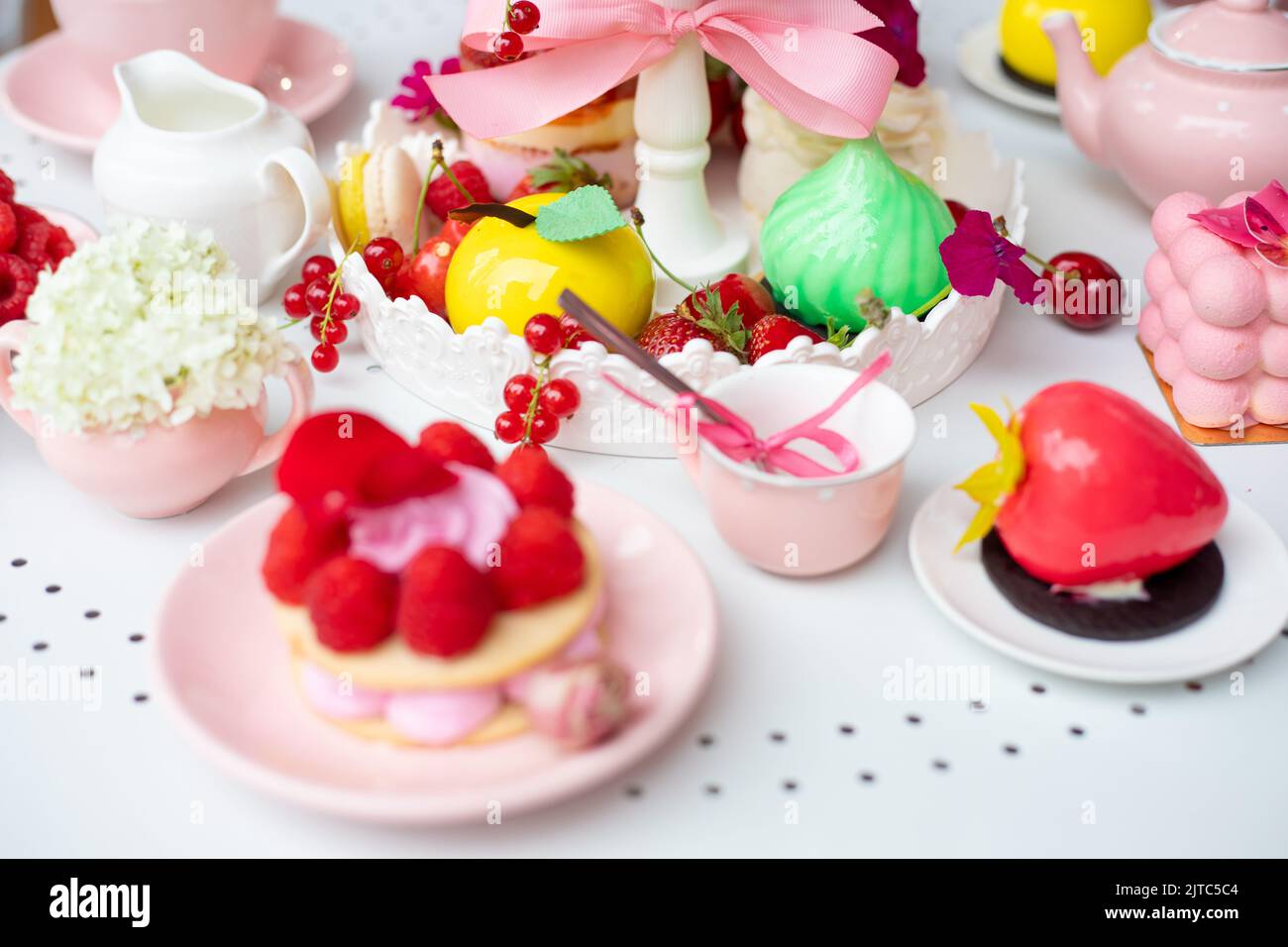 Big assortment of sugar dessert treats on white table in cafe or candy ...