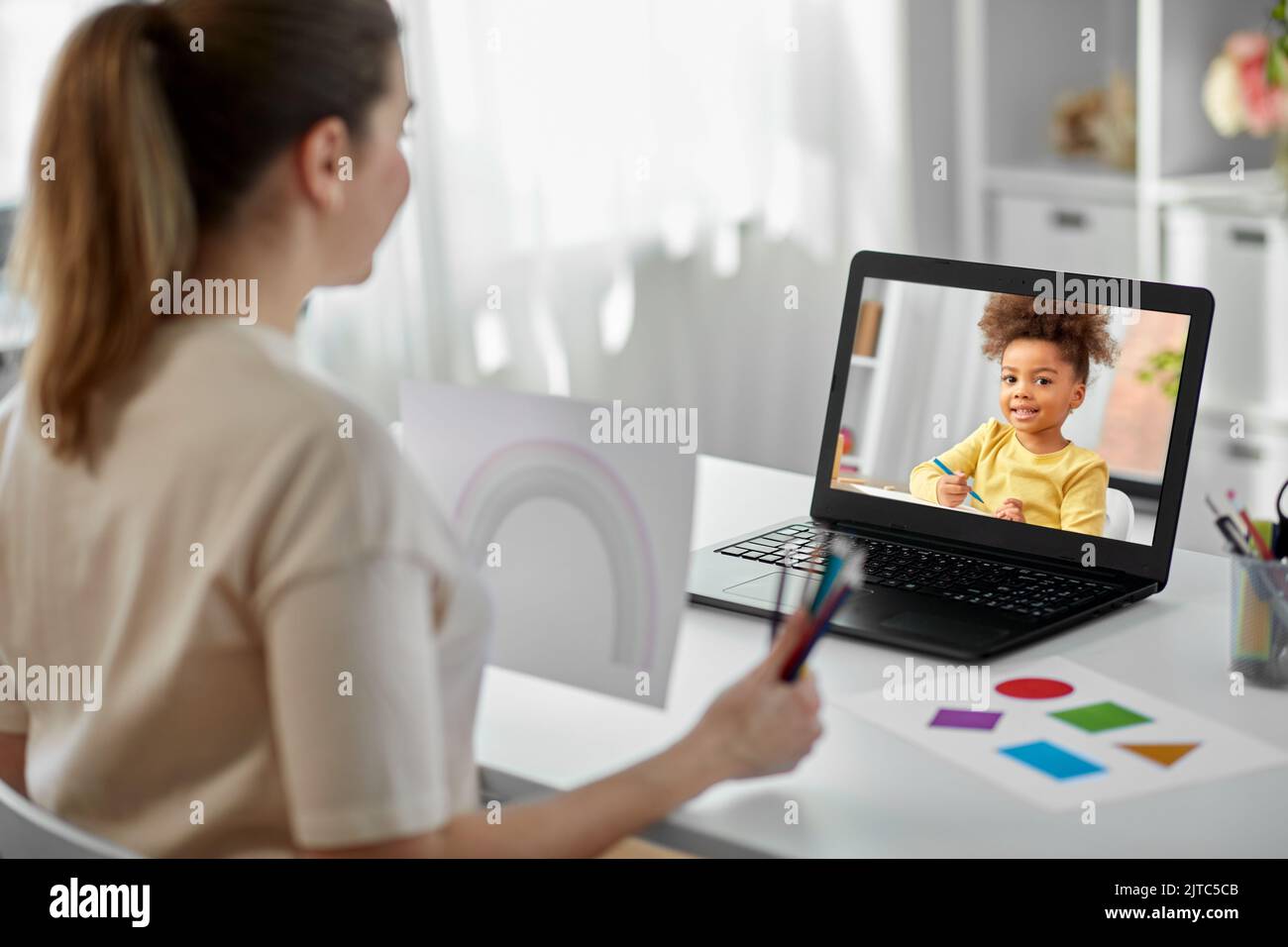 teacher having online class at home Stock Photo - Alamy