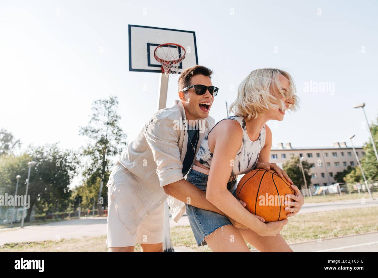 Young couple playing basketball on hi-res stock photography and images ...