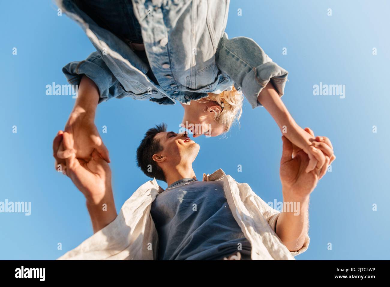 Below angle people hands holding hi-res stock photography and images ...