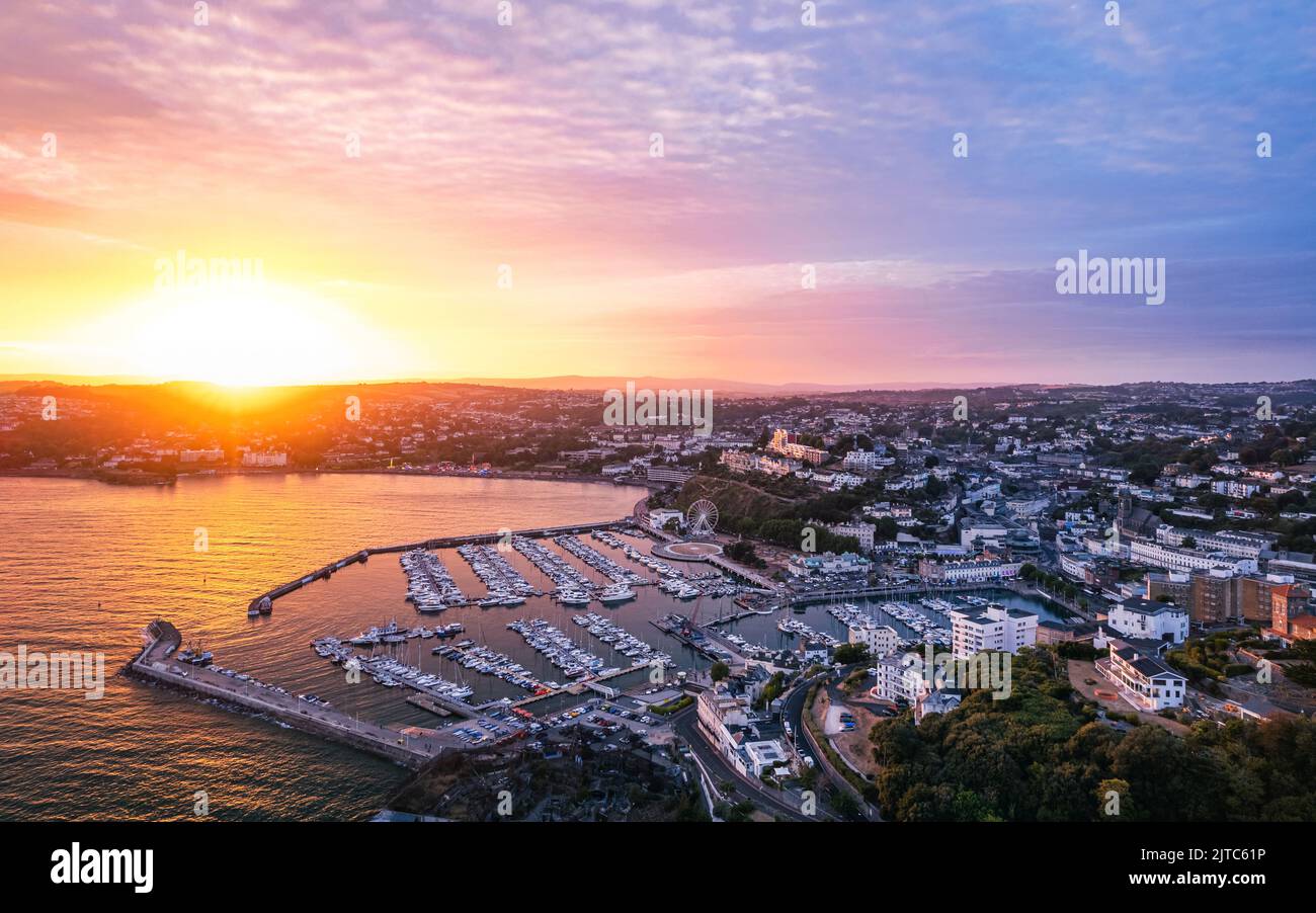 Sunset over Torquay Harbour and Marina, English Riviera from a drone ...