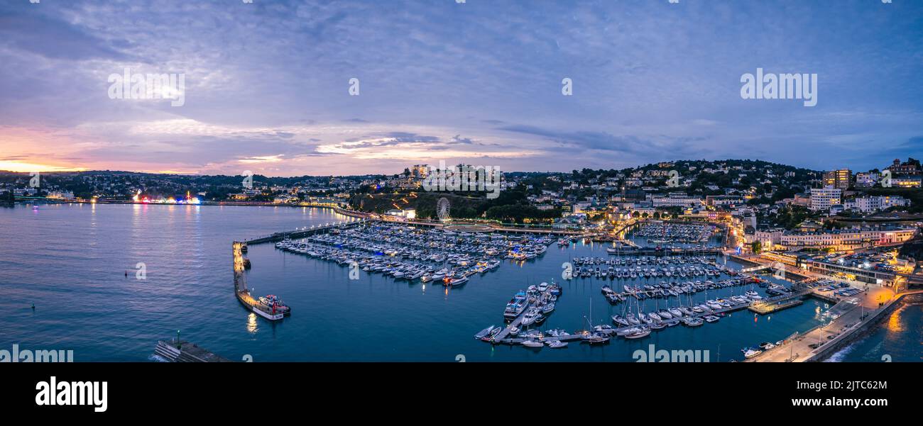 Sunset over Torquay Harbour and Marina, English Riviera from a drone ...