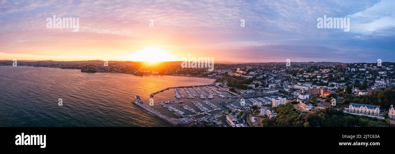 Sunset over Torquay Harbour and Marina, English Riviera from a drone ...