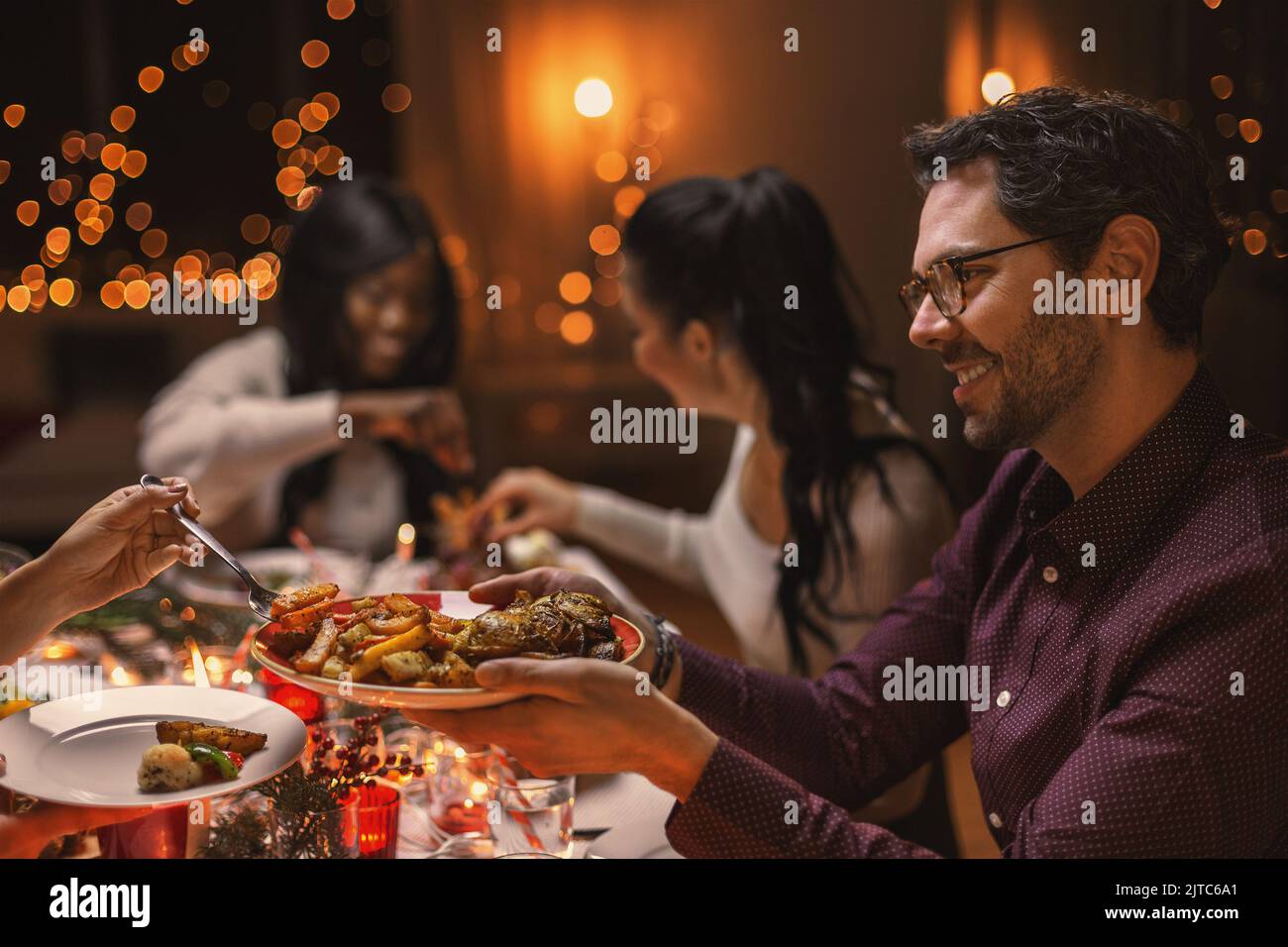 Black family having dinner home hi-res stock photography and images - Alamy