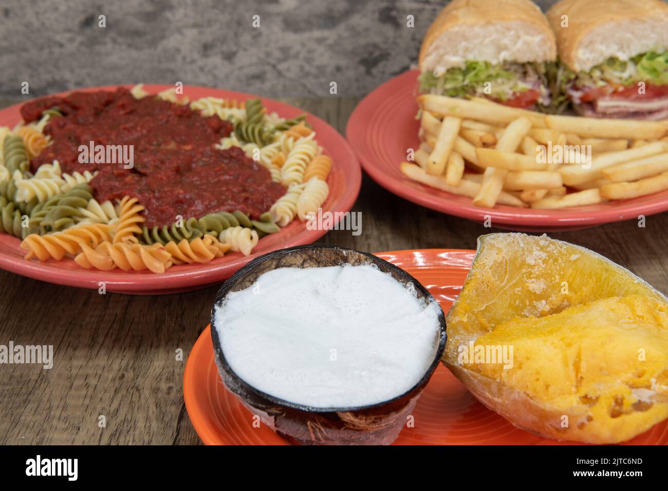 Italian food feast is set up on the table with a choise of pasta in ...