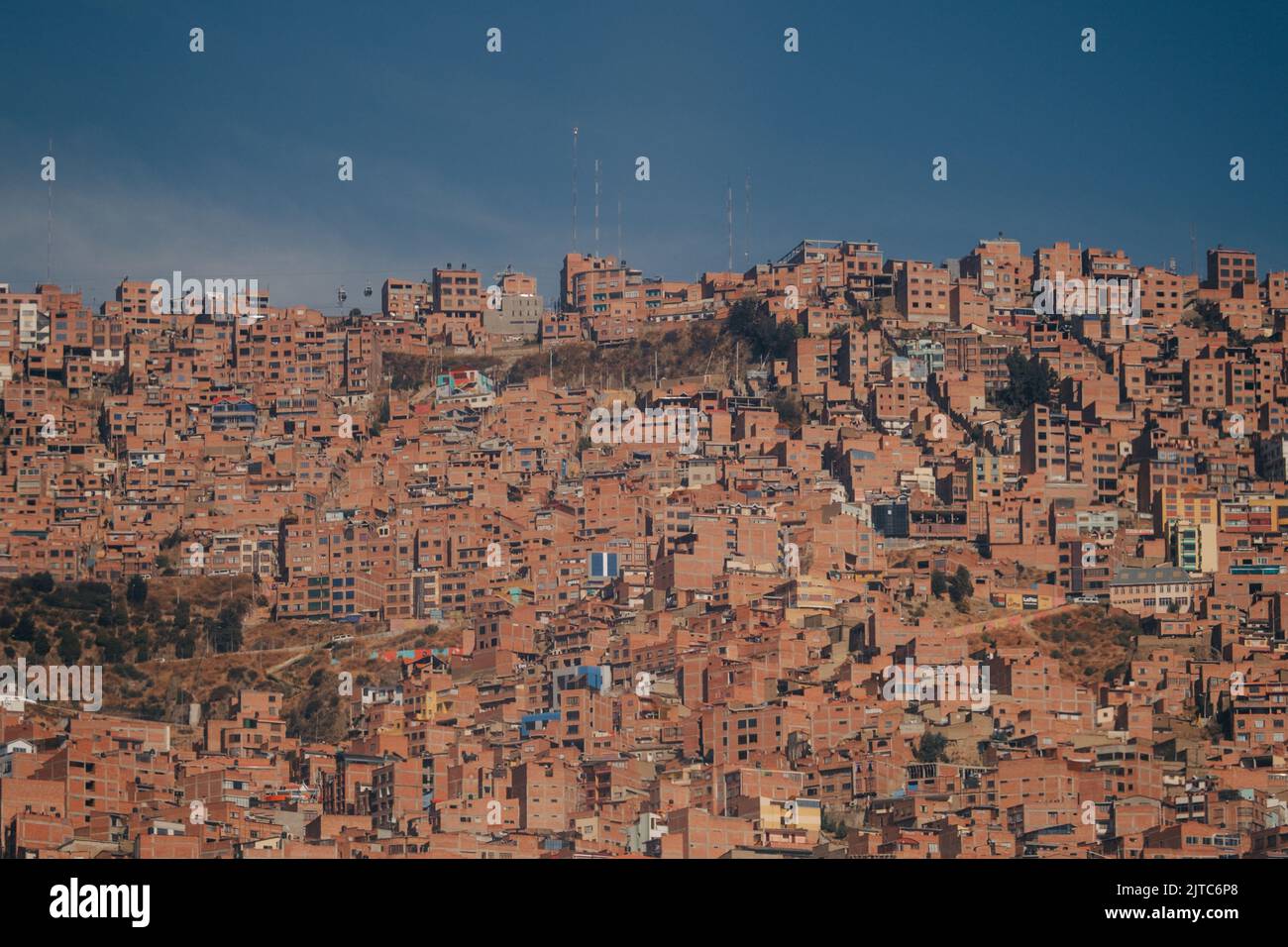 An urban area with red buildings that are built on top of a hill Stock ...