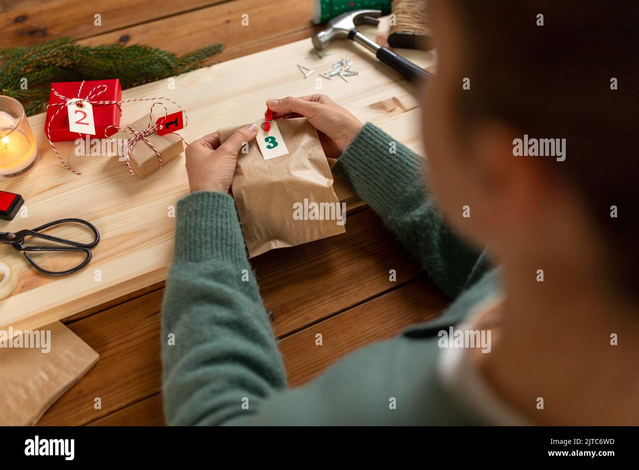 hands making christmas advent calendar at home Stock Photo - Alamy