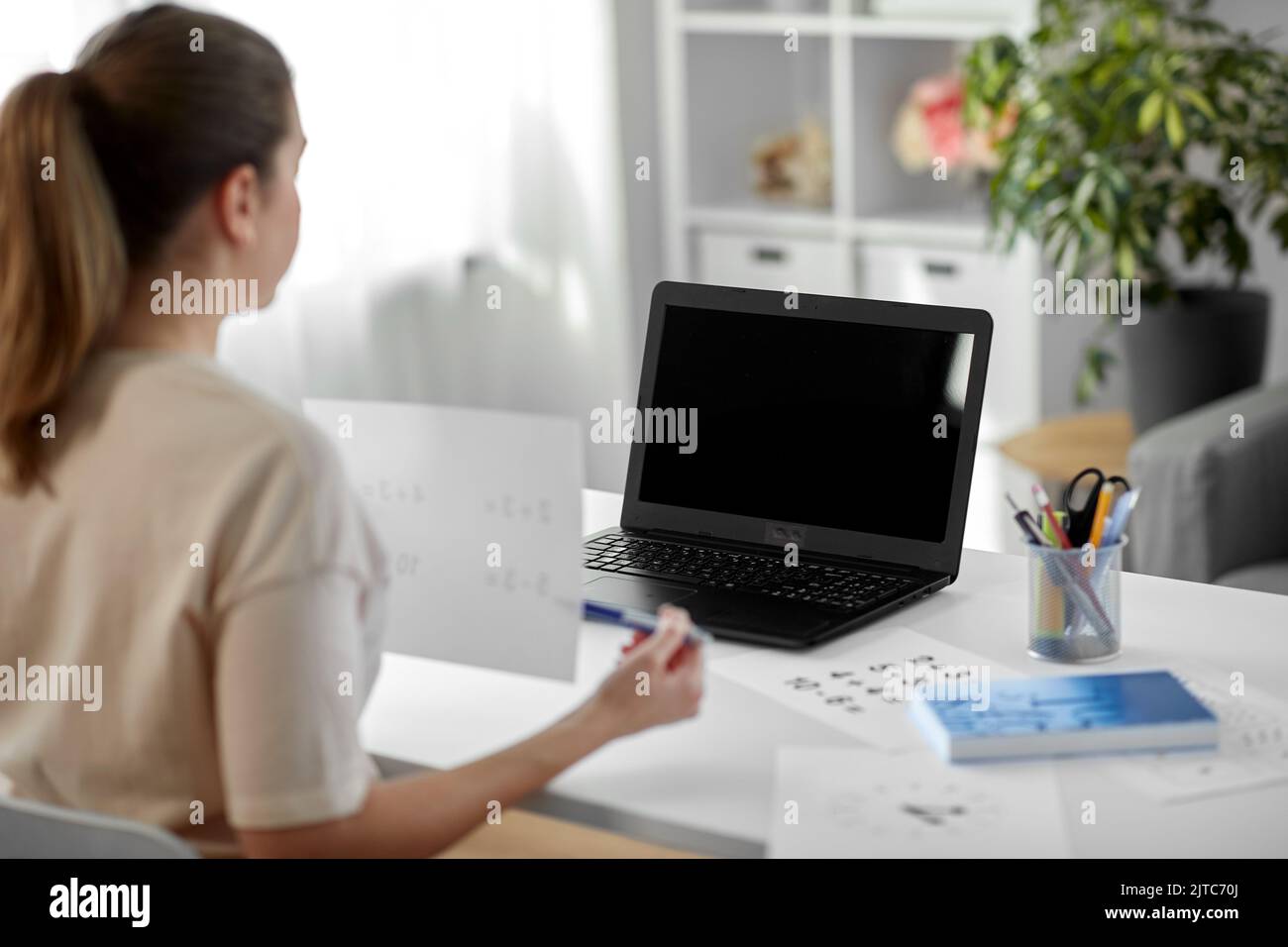 math teacher having online class at home Stock Photo - Alamy