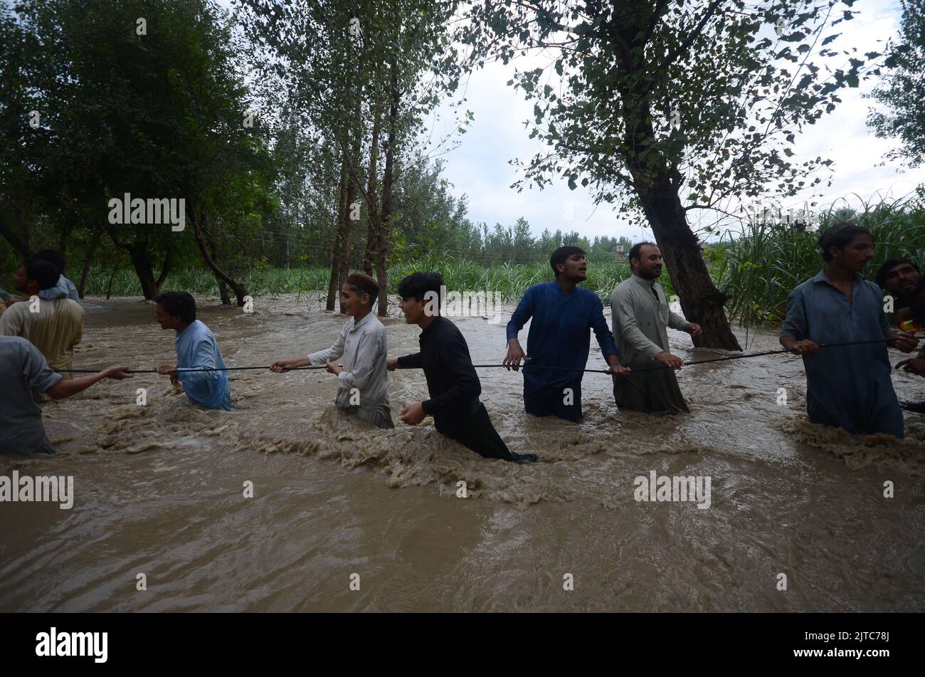 Peshawar, Pakistan. 26th Aug, 2022. Torrential rains and storms cause ...